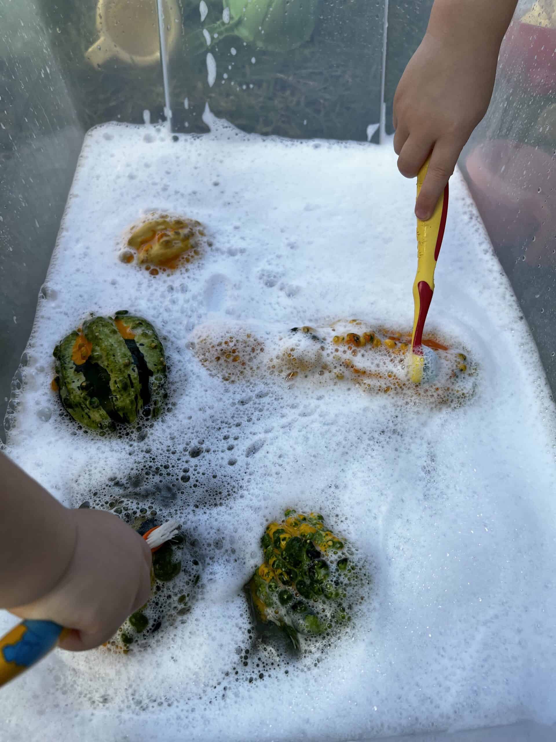 Pumpkin wash fall sensory bin for kids - Celebrating with kids
