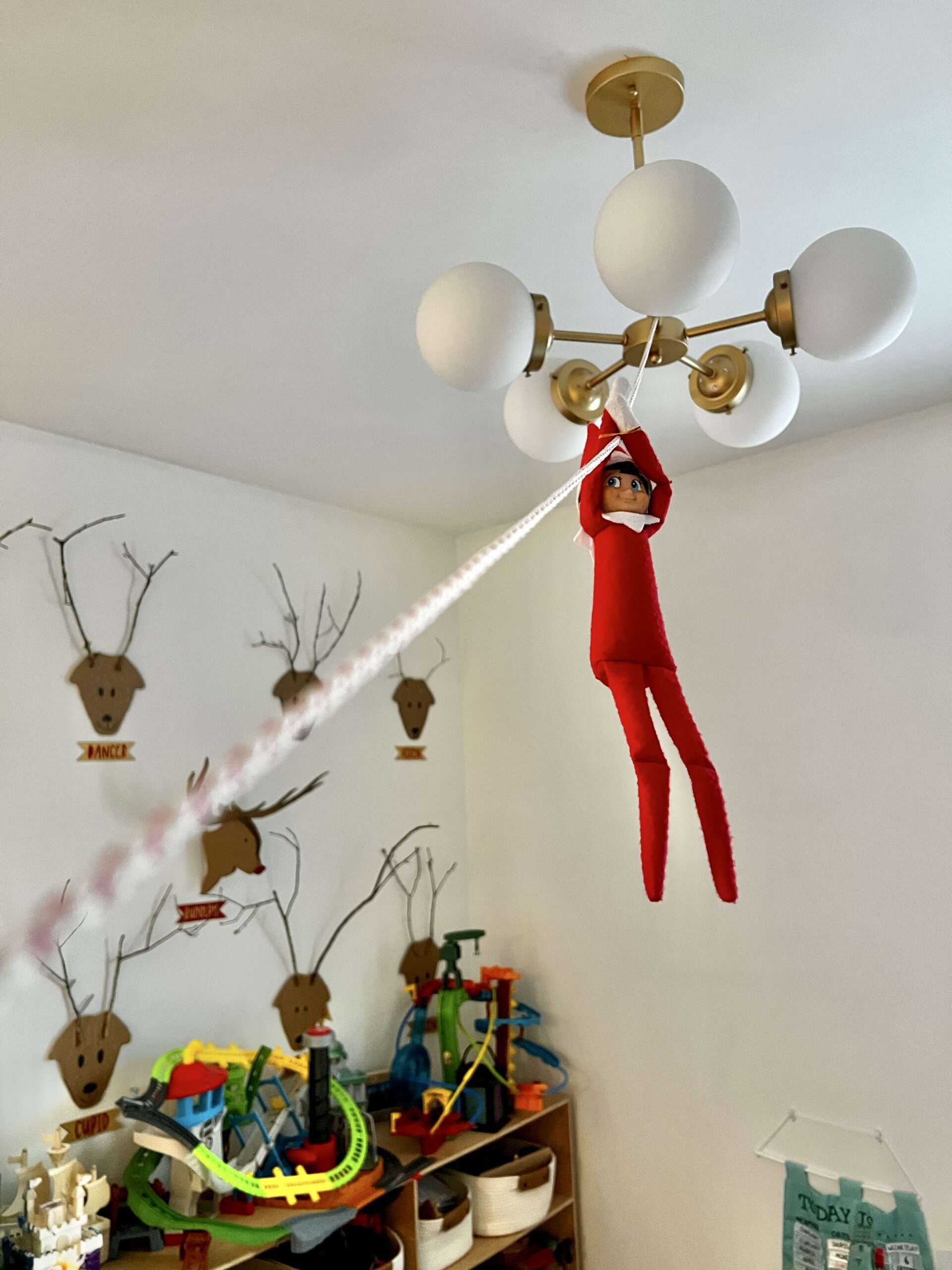 Elf on the Shelf idea: easy zipline - Celebrating with kids